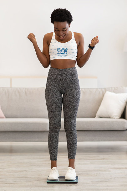 Placeit - Sports Bra Mockup of a Woman Eating a Donut