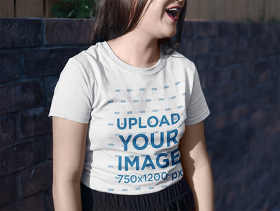 Placeit - Mockup of a Cropped Face Woman Wearing a Tee while Sitting ...