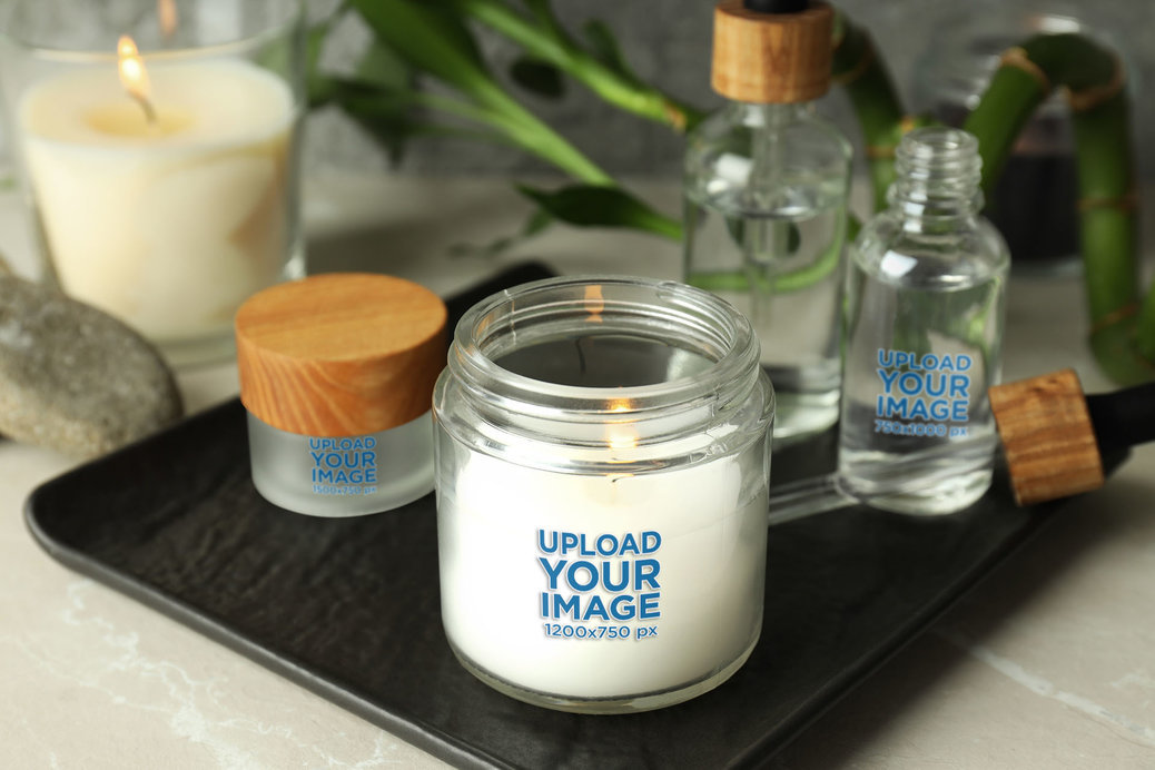 Placeit - Burning Candle Mockup Featuring a Dropper and a Cosmetic Jar