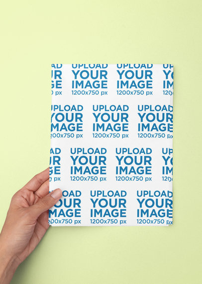 Placeit - Mockup of a Person Holding a Piece of Wrapping Paper