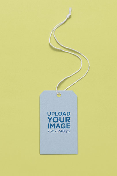 Placeit - Mockup of Three Brand Tags on a Plain Surface
