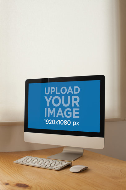 Placeit - iMac Mockup Standing on a Recycled Compressed Wooden Desk