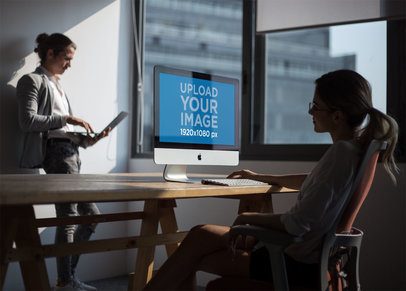 Placeit - Smiling Business Woman Working on Her iMac Mockup