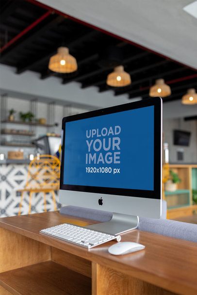 Placeit - Mockup of an iMac Featuring a Picture Frame