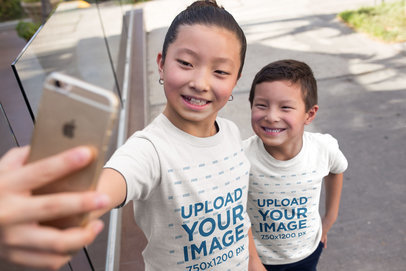 Placeit - T-Shirt Mockup of a Happy Asian Kid in a Playground