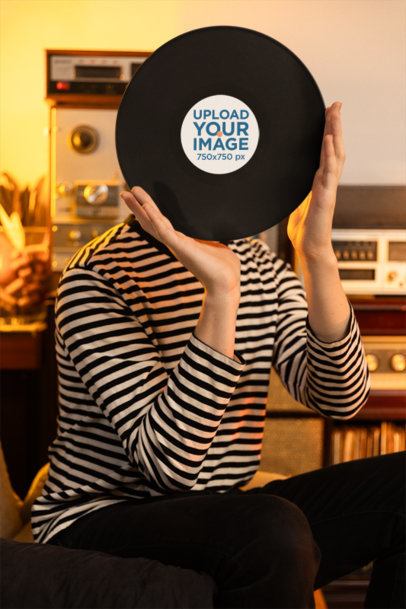 Placeit - Mockup of a Man Putting a Vinyl on an Old Record Player