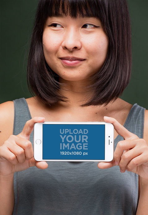 Placeit - iPhone 8 Plus Mockup Held Horizontally by a Woman