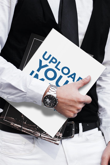 Placeit - Mockup of an Elegant Man Holding a Magazine