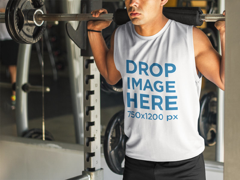 Placeit - Sleeveless Shirt Mockup of Young Muscular Man at the Gym