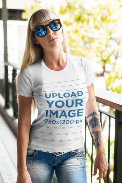 Placeit - T-Shirt Mockup of a Woman with an Arm Tattoo Posing by a ...