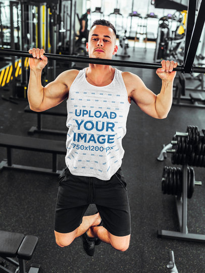 Placeit - Tank Top Mockup of a Muscular Man Doing Pull-Ups at the Gym