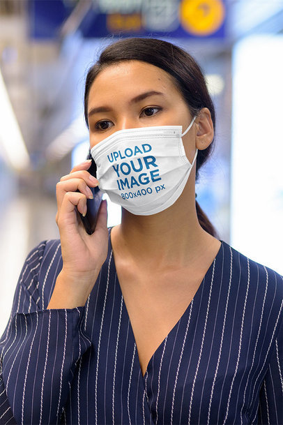Placeit - Sublimated Face Mask Mockup of a Woman Checking Her Mobile Phone