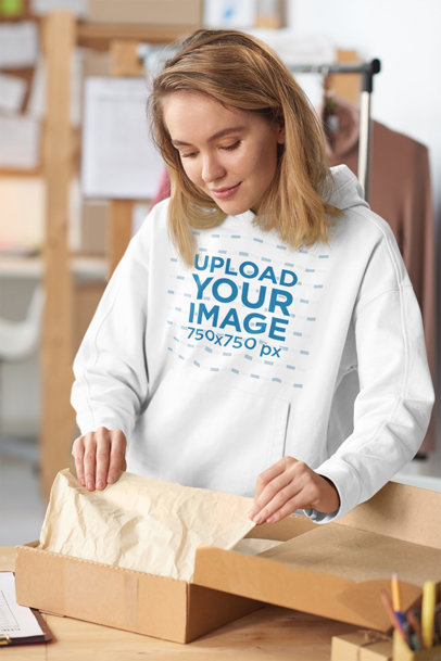 Placeit - Hoodie Mockup Featuring a Young Woman Packing Some Items for ...