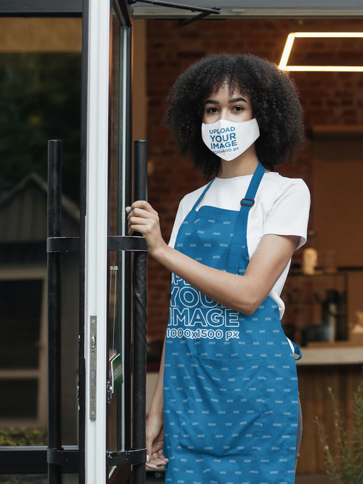 Placeit - Face Mask and Apron Mockup Featuring a Long-Haired Woman