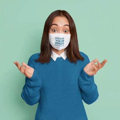 Placeit - Face Mask Mockup Featuring a Confused Woman Standing in a Studio